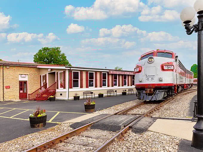Parked beside the charming station, this gleaming locomotive waits to whisk passengers away on an unforgettable culinary journey.