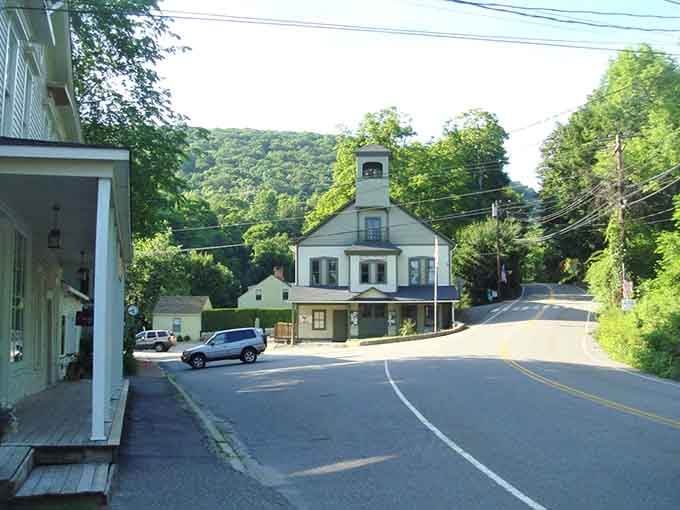 The quiet main street curves gently past this charming structure, inviting you to slow down and stay awhile.