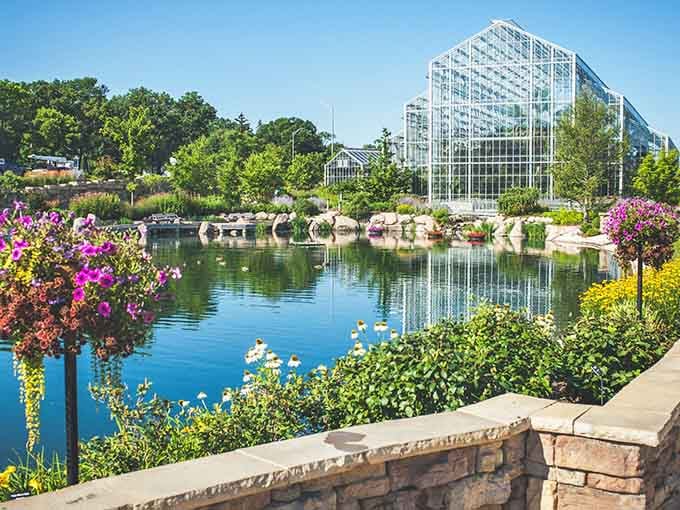 The lagoon reflects those stunning conservatory structures like nature's own mirror showing off its best work.