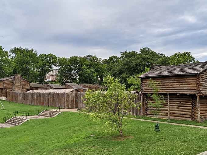 The fort's wooden stockade stands ready, though these days the only invasion involves curious tourists with cameras and questions.