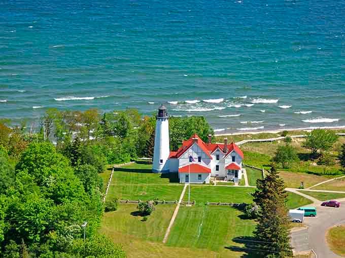 From above, the manicured grounds and red roofs create a pattern as satisfying as a perfectly set dinner table.