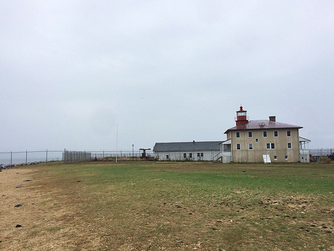 Gray skies hang heavy over this isolated lighthouse where Civil War prisoners once suffered in nearby camps.