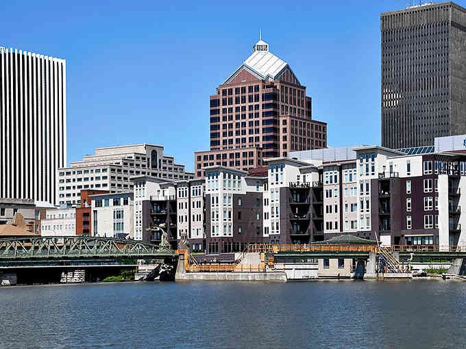 The Genesee River reflects Rochester's architectural gems, offering waterfront views that rival cities charging triple the rent to enjoy them.