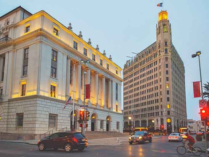 Classic architecture meets evening elegance here, where illuminated columns and art deco towers create a scene straight from the golden age.