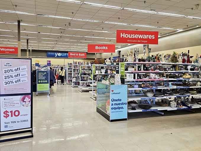 Bright overhead lights illuminate aisles of housewares and books organized better than most department stores you remember.