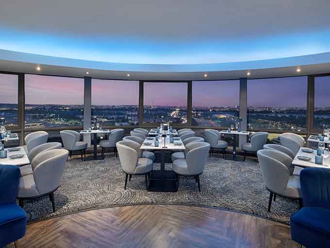 Floor-to-ceiling windows wrap around this rotating restaurant where every seat becomes the best seat in town.