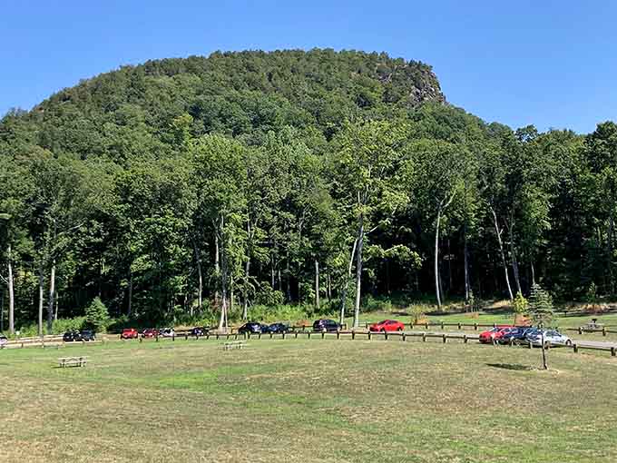 The sleeping giant's dramatic profile rises majestically from the valley floor, complete with parking for admirers.