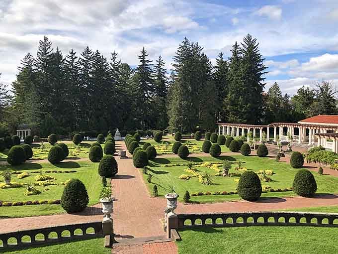 Sculpted hedges march in formation across these formal gardens, creating geometric patterns that would make Versailles jealous.