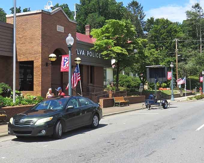 Main Street brick buildings and patriotic flags create a scene straight from everyone's favorite small-town memories.