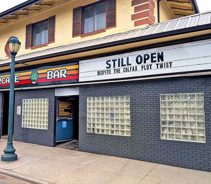 That marquee humor says it all—this arcade bar survived everything and still serves up nostalgia with a wink.