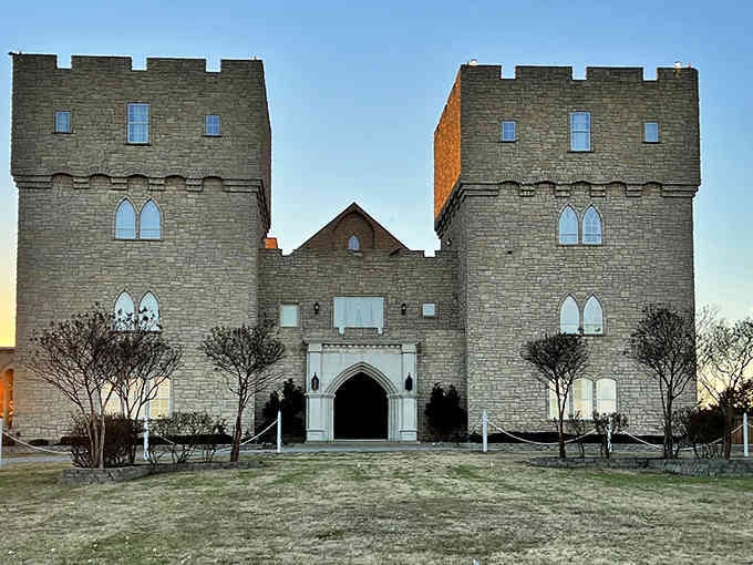 Twin towers stand guard at sunset, their medieval silhouettes creating a dramatic entrance that'll make you forget you're in Texas.