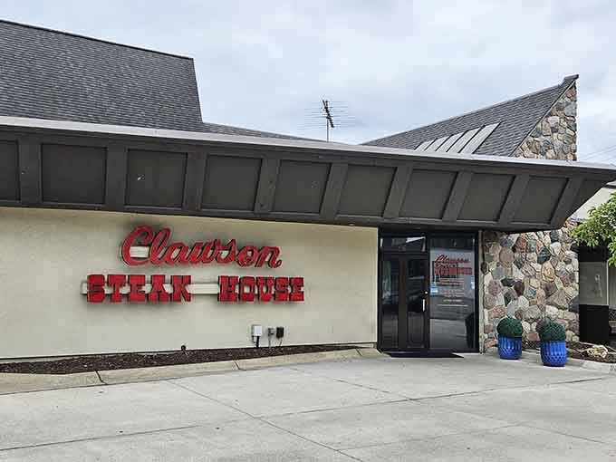 Those blue planters flanking the entrance add a welcoming touch to this timeless neighborhood steakhouse destination.