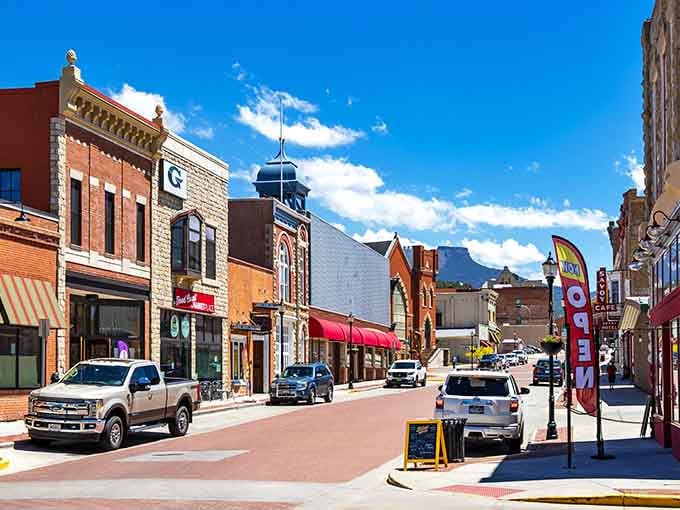 Blue skies highlight brick facades where local shops thrive, reminding us that charm beats chains every time.