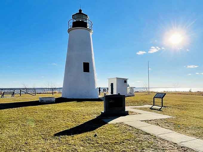 That dramatic sunburst behind the lighthouse makes you feel like you're watching a Hollywood movie premiere.