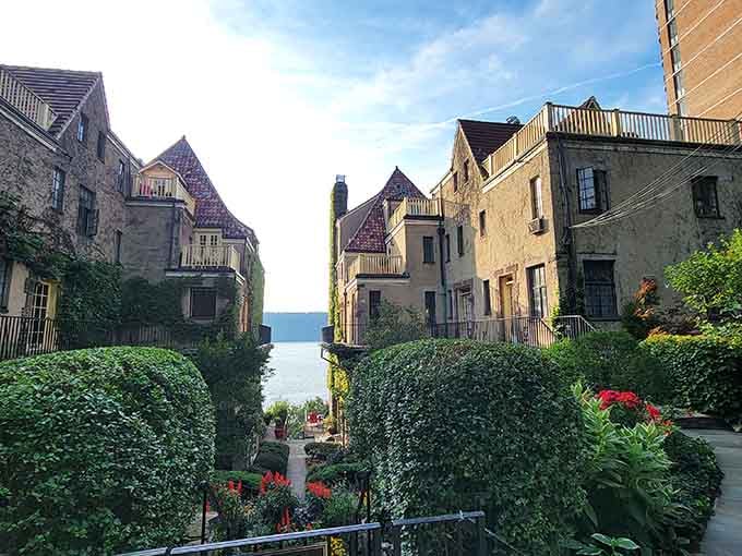 The manicured gardens and Mediterranean architecture transport you straight to a sun-drenched Spanish hillside overlooking the water.