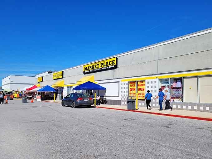 Market Place's cheerful yellow sign welcomes bargain hunters to a sprawling outdoor shopping adventure under sunny skies.