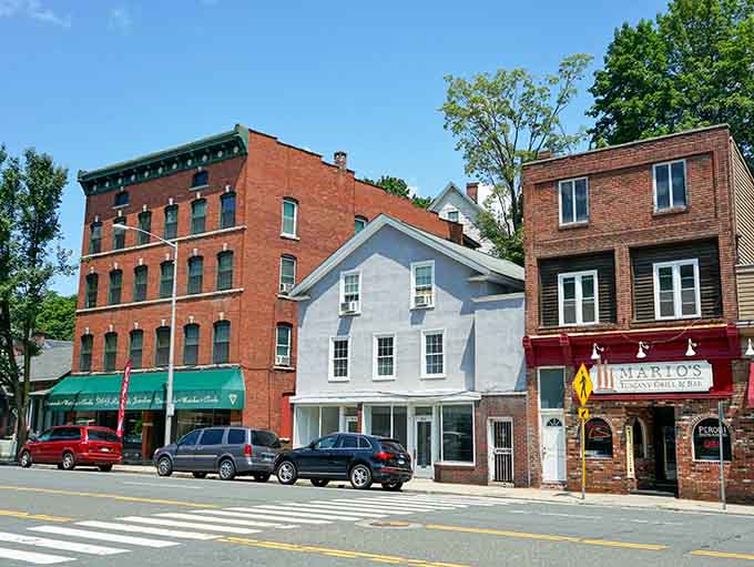 These brick storefronts along Main Street have watched generations pass by, each window telling its own quiet story.