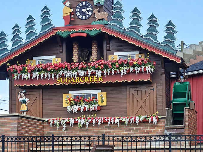 Every detail shines on this Swiss-style masterpiece, from the carved wooden band to the cheerful blooms cascading down.