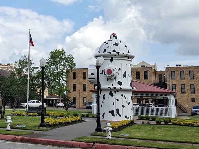 The red nose and spotted design make this functional hydrant look like it's ready for its close-up.