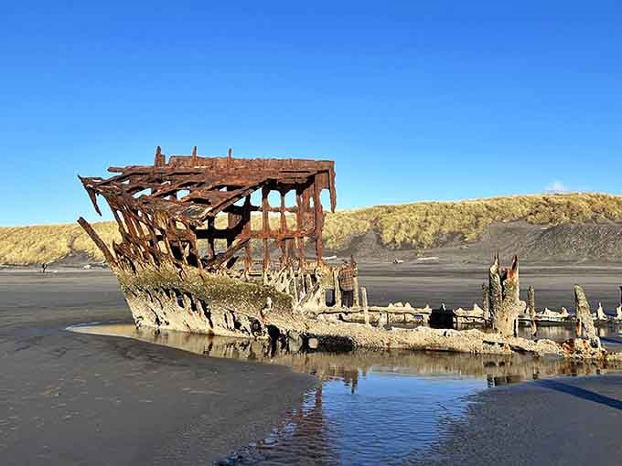 The rusted skeleton of this old vessel creates a hauntingly beautiful scene against the Pacific waves.