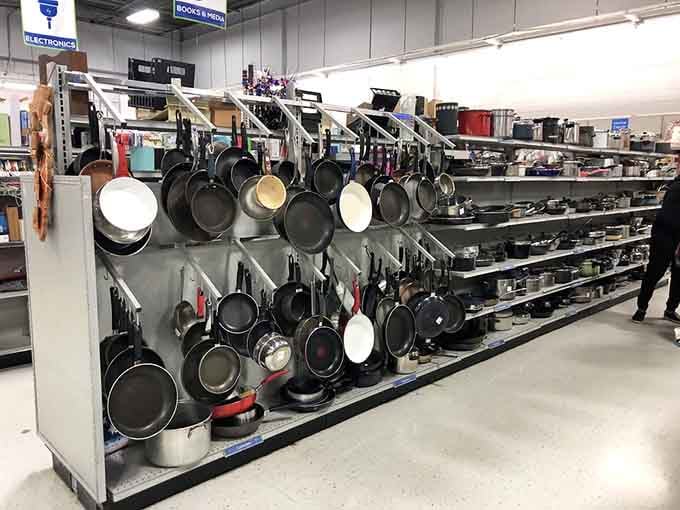 When your cookware display looks like a culinary museum, you know someone's taking organization seriously here.
