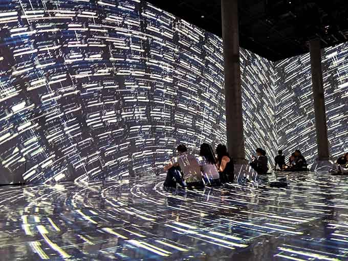 Geometric light patterns transform ordinary floors into portals, making you question if you've accidentally stepped into the Matrix.