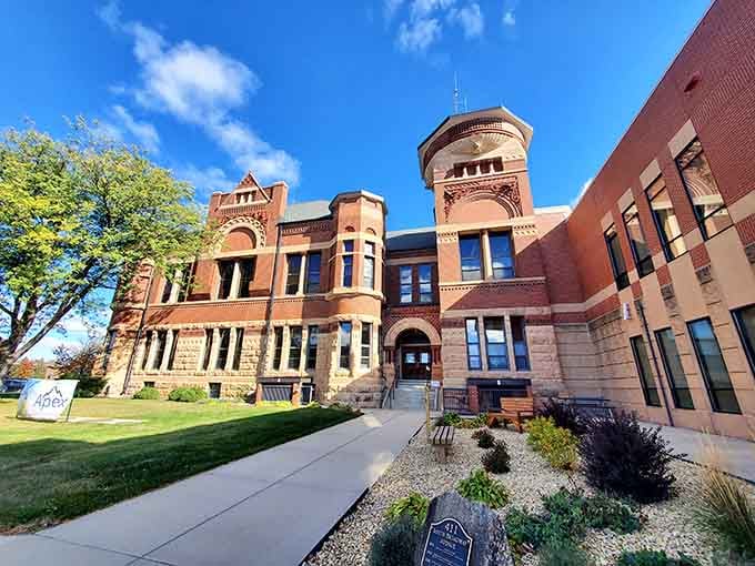 The Romanesque Revival courthouse commands attention with its tower, proving small towns can have big architectural ambitions.