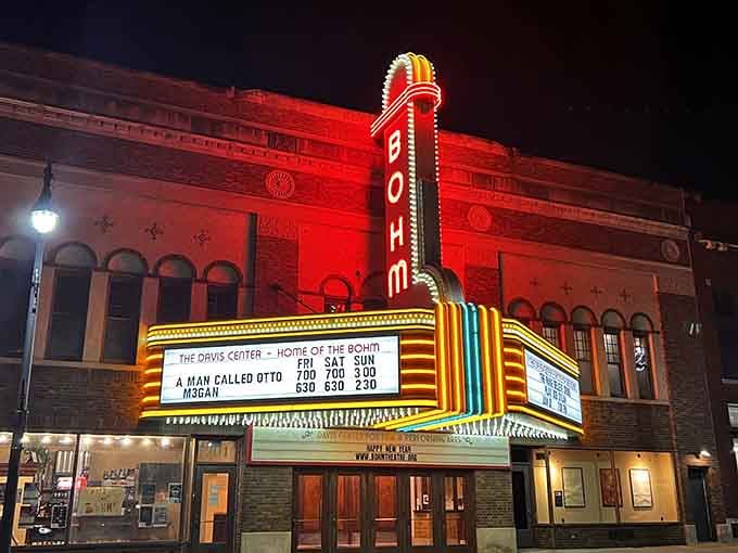The Bohm Theatre's marquee glows like a beacon of culture, proving entertainment doesn't require streaming services or Wi-Fi.
