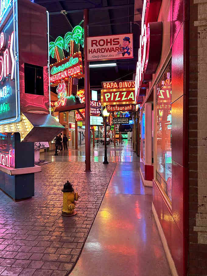 Walking this neon-lit corridor feels like stepping into every great American road trip you've ever taken or dreamed about.