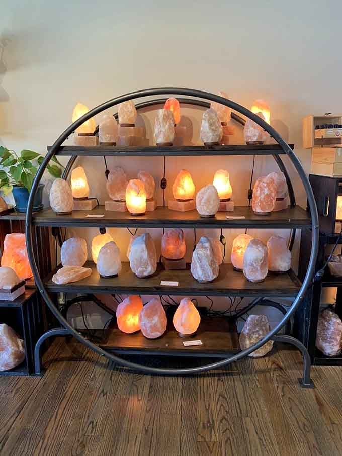 Salt lamps stacked like glowing treasures, each one ready to brighten your home and maybe your mood.