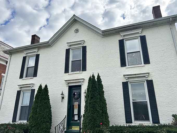 Classic white brick and black shutters: the architectural equivalent of a little black dress that never goes out of style.