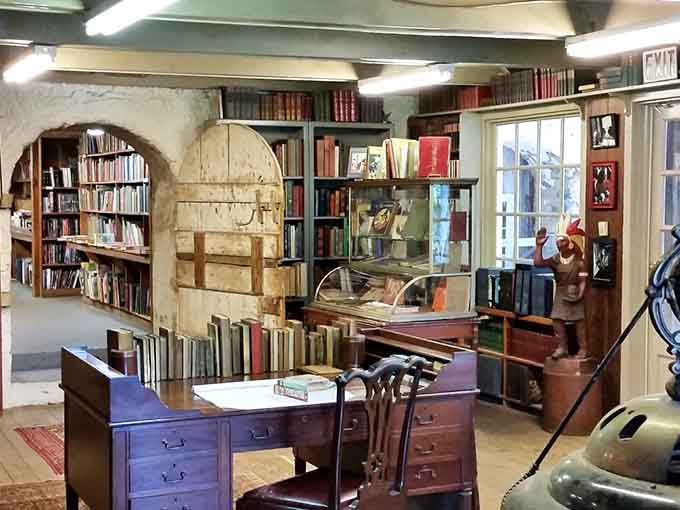 Stone arches and wooden beams create reading nooks that would make Belle from Beauty and the Beast jealous.