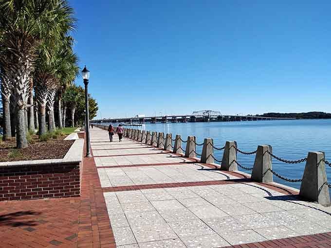 The waterfront promenade stretches endlessly, perfect for morning walks or contemplating why your hometown doesn't look like this.