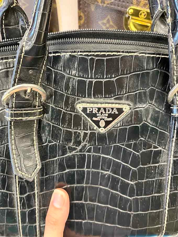 That Prada bag sitting there casually like it didn't just make someone's entire year with its price tag.