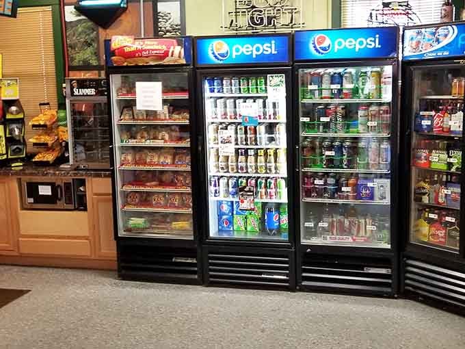 Cold drinks waiting behind glass doors, the universal symbol that civilization is within reach.