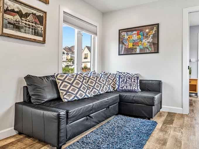 Windows frame waterside views while geometric pillows add just the right pop of pattern to this inviting retreat.