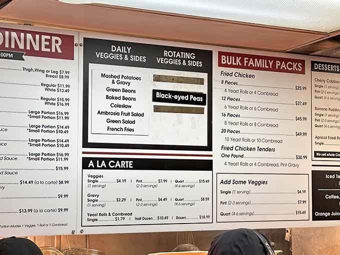 The menu board reveals a treasure trove of Southern classics, from fried chicken to rotating daily vegetables.