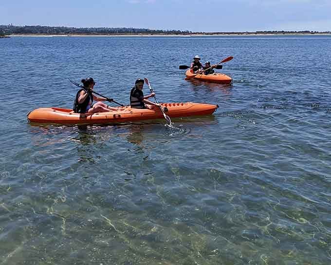 Nothing says California living quite like paddling bright orange kayaks through crystal-clear bay waters.