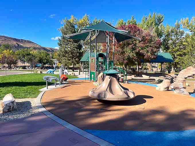 Modern playgrounds meet mountain views, proving retirement towns know how to keep the grandkids entertained during visits.