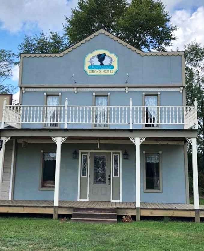 Martha's Grand Hotel beckons with its pale blue facade and second-story balcony, looking like it stepped straight from a classic Western film.