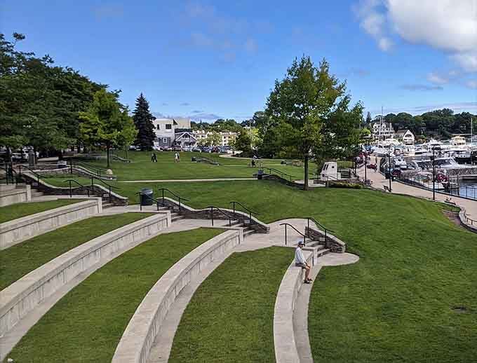 Terraced lawns cascading toward the marina like nature's own amphitheater for watching boats and contemplating life.