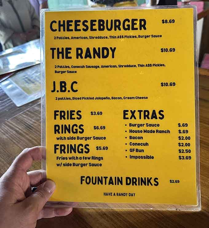 That glorious yellow menu is basically a treasure map, and X marks the spot where massive burgers live.