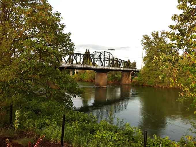 The trail winds along the river where water meets land, and your daily stress meets its match.