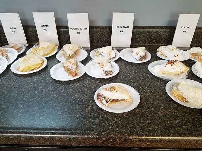 Five different pies lined up like the starting lineup of your dreams, each one ready to ruin your diet plans.