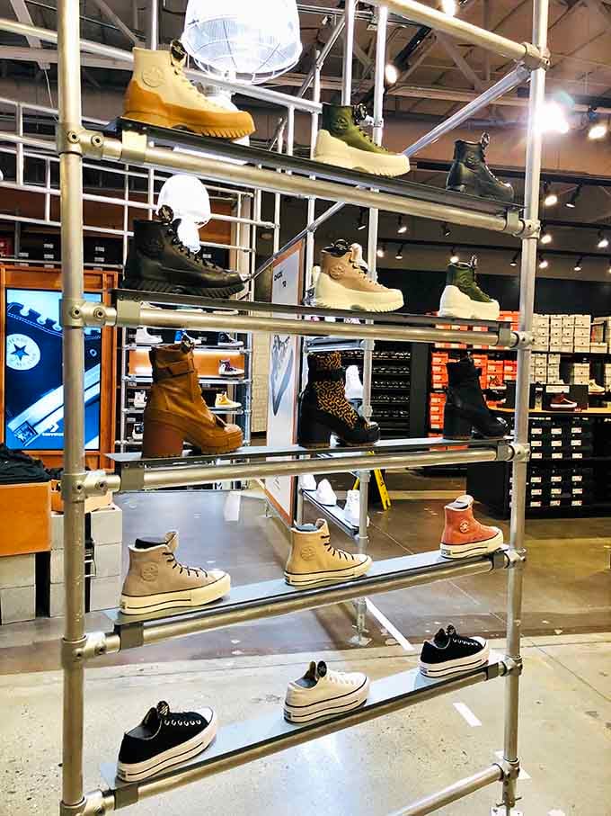 From classic Converse to rugged boots, this footwear display rises like a sneaker lover's version of the Eiffel Tower.