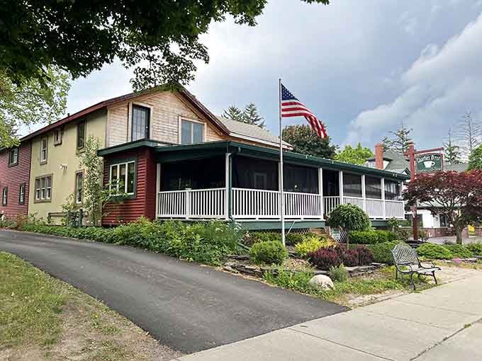 That classic house with the porch where neighbors probably still wave to each other like civilized humans.