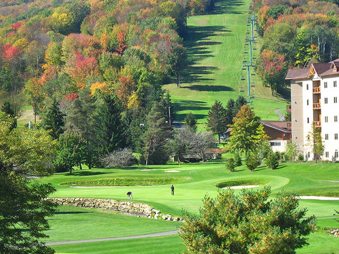 Ski slopes transform into emerald fairways where your golf game enjoys views that almost excuse your terrible swing.