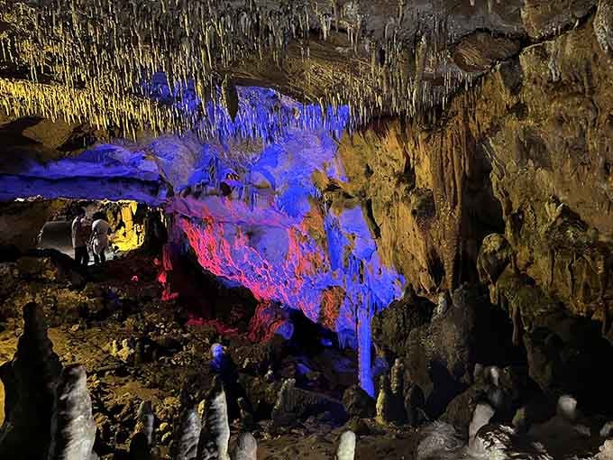 Colored lights transform ancient limestone into something that belongs in a sci-fi movie, minus the aliens.