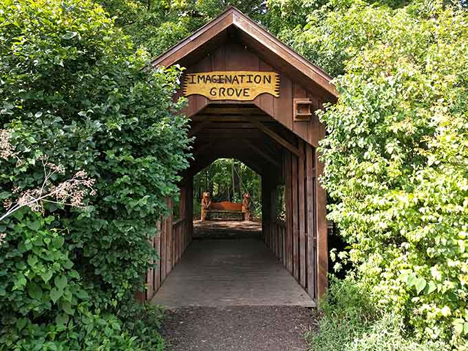 The Imagination Grove bridge beckons like something from a fairy tale, promising adventures just beyond that charming wooden archway.