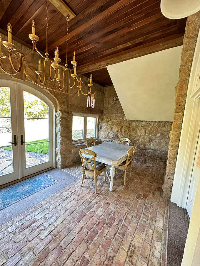 Exposed wooden ceilings and brick floors create the kind of rustic elegance you'd expect in a Tuscan villa.